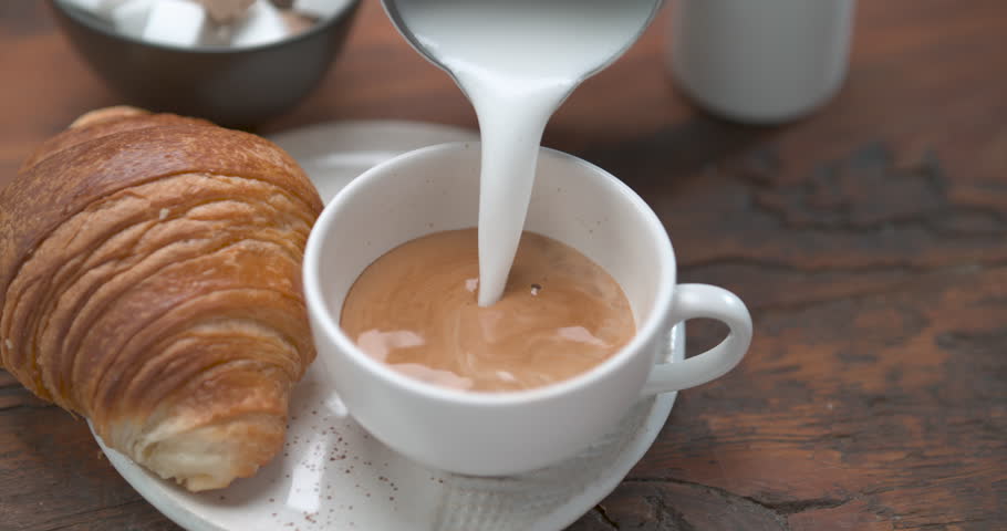 Pouring Coffee and Cream into a Cup image - Free stock photo - Public ...