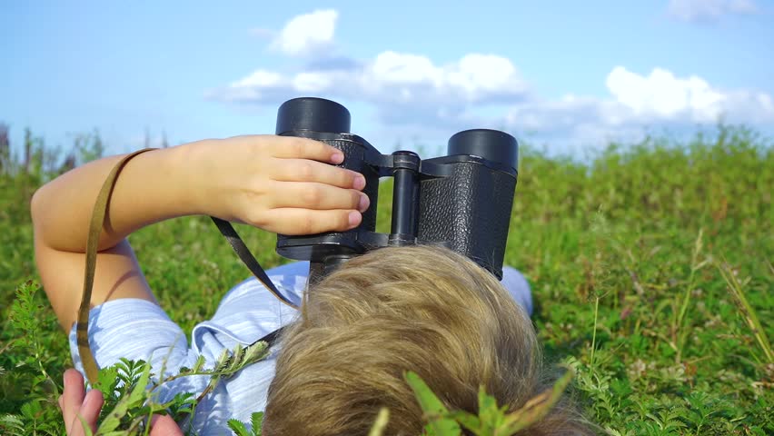 Child using binoculars Stock Video Footage - 4K and HD Video Clips ...