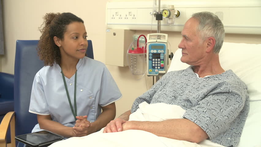 Nurse Sitting at Bedside of Stock Footage Video (100% Royalty-free ...