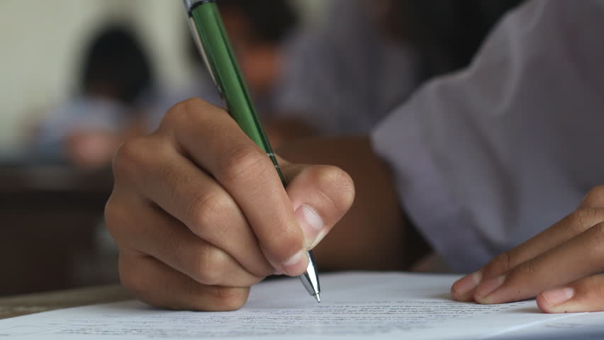 Student Holding Pen and Writing Stock Footage Video (100% Royalty-free ...