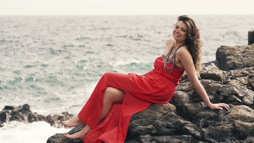 Woman In The Mountains. Beautiful Girl Fashion Model Sitting On A Rock ...