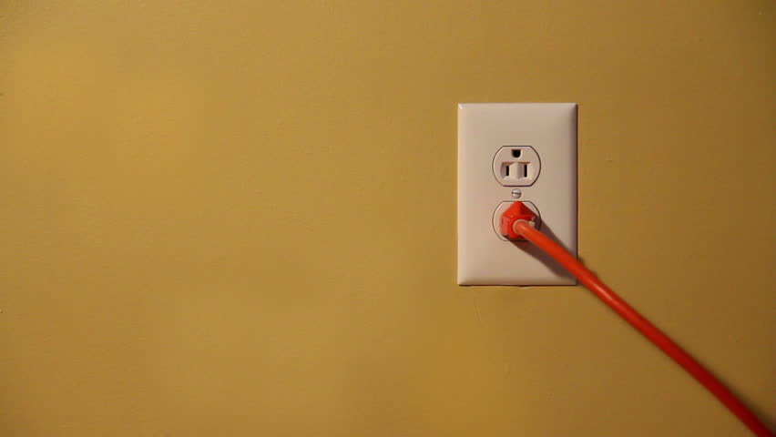 Close-up Shot Of A Man Plugging And Unplugging An Orange Electrical ...