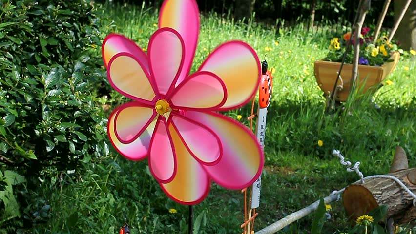 Wind Turns The Windmill. A Child's Toy In The Garden. The Park In The ...