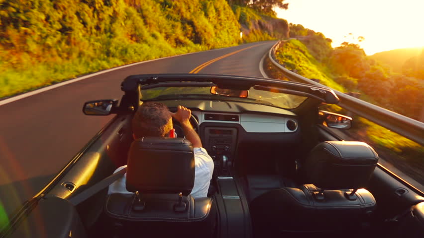 Happy Handsome Young Man Driving Convertible Car Into Sunrise On ...