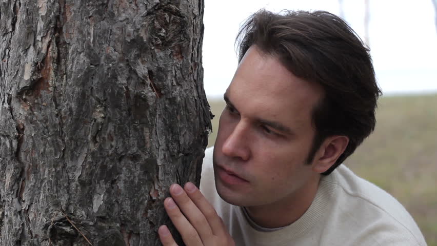 Man Spying Hiding Behind A Tree Close-Up Stock Footage Video 16791148 ...