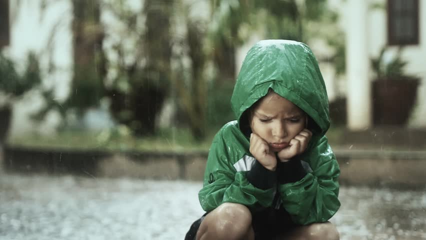 Poor Lonely Child Staying Alone In The Rain And Catching Raindrops By ...