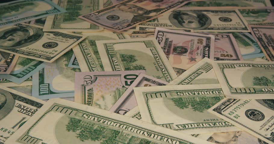 US Dollars Bundle Closeup Rotation On The Top Of Usd Banknotes Heap ...