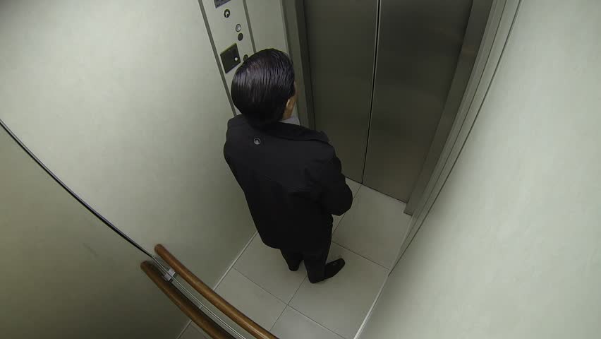 BUILDING ELEVATOR - A High Angle Shot In Slow Motion Of An Elevator's ...