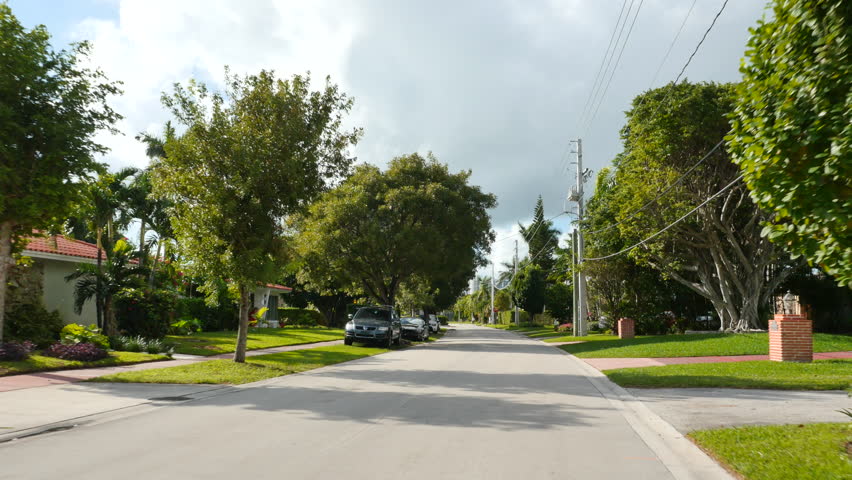 A Car Ride Down Road In Residential Suburban Neighborhood Looking At ...