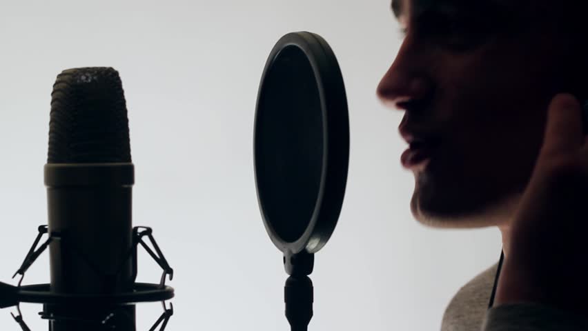 Handsome Guy Sings In A Microphone Standing Studio Headphones ...