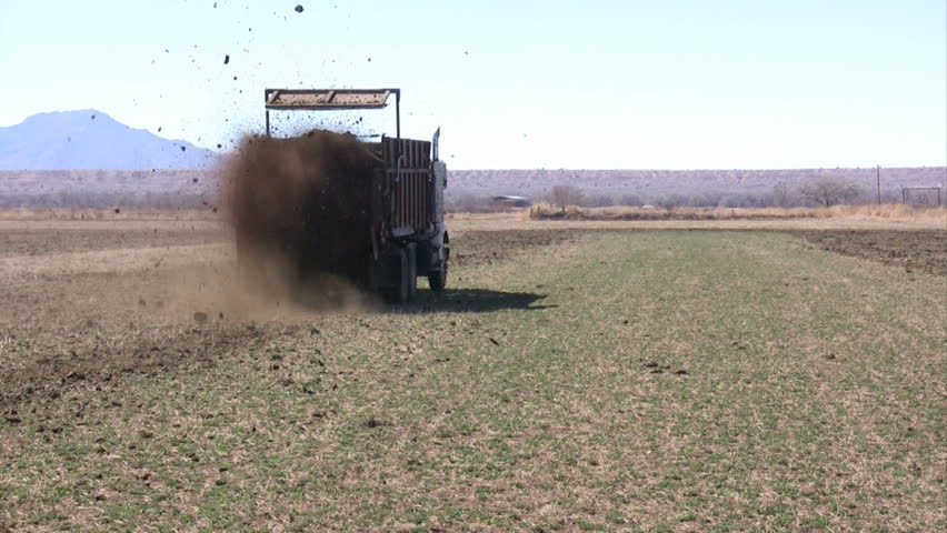 Close Up Of A Truck Spreading Cow Manure In A Field. Stock Footage ...