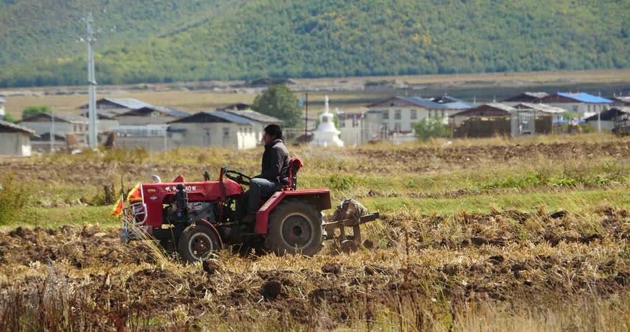 4k Tibetan People Use Farm Tractor Arable Land,far Away Other People ...