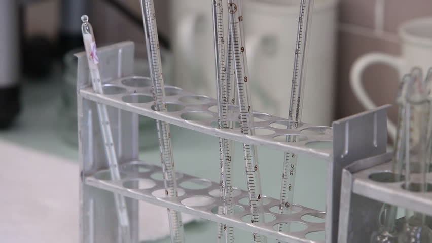 Laboratory Analyzing Milk. Assistant Put A Glass Of Milk For Analysis ...