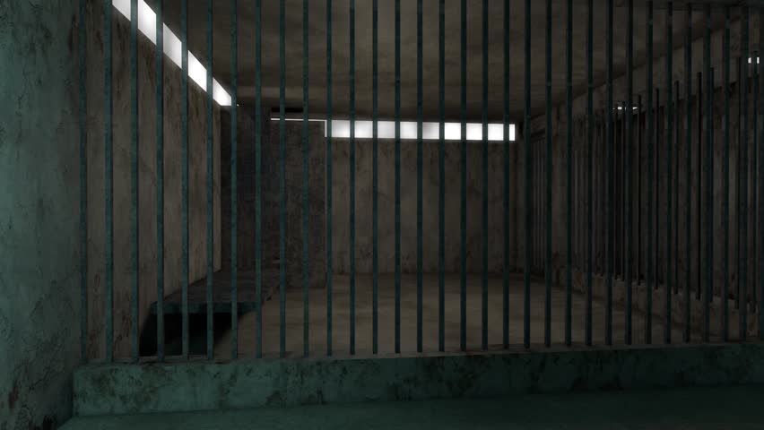 A Slow Pan Of An Empty Dark Jail Cell With Light Rays Penetrating A ...
