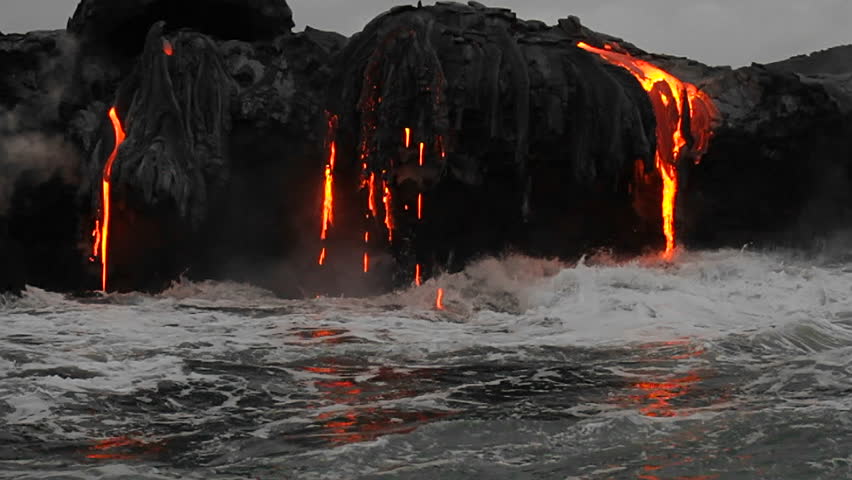 Evening Sunlight Over Billowing Steam From Lava Falling Into Ocean ...