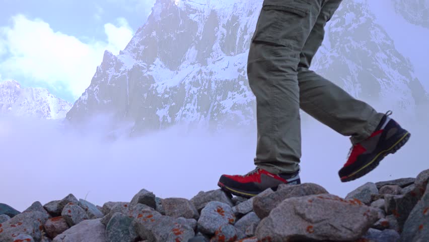 Female Hiker Walking On Rough Terrain. Foot Steps In Slow Motion ...