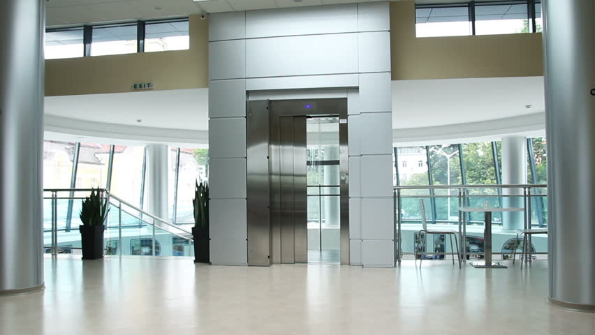 BUILDING ELEVATOR - A High Angle Shot In Slow Motion Of An Elevator's ...