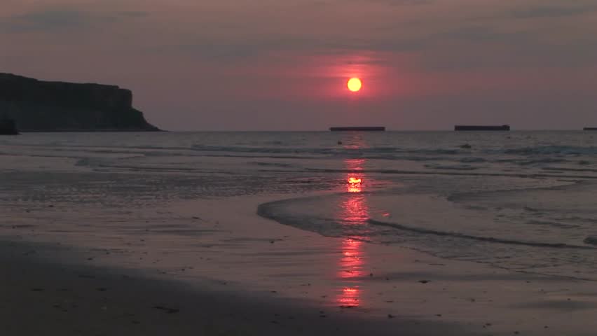 D-Day Landing Beach Code Named Gold Beach With Pink Sunset And View Of ...