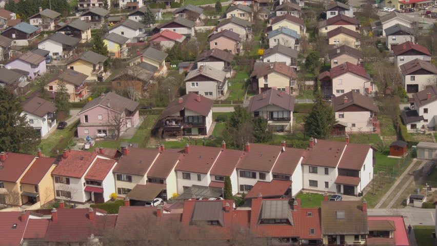 AERIAL: Flying Above Lush Treetops Towards Luxury Suburban Town ...
