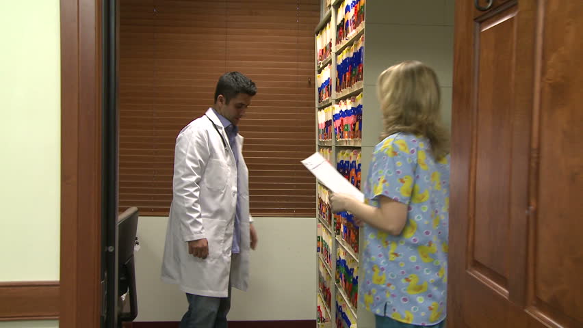 Doctor and Nurse in Filing Stock Footage Video (100% Royalty-free ...