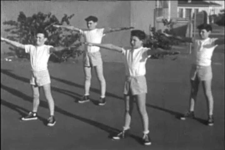Boys Demonstrate A Rhythmic Exercise In Regular And Slow Motion ...