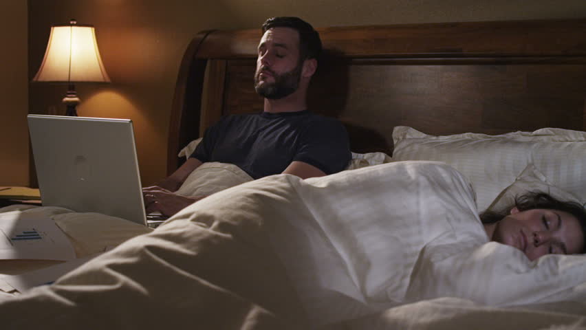 Young Woman At Home Sitting On The Sofa, She Is Working With A Laptop ...
