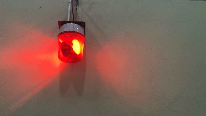 Red Flashing Emergency Signal Siren Light On Concrete Wall. Stock ...