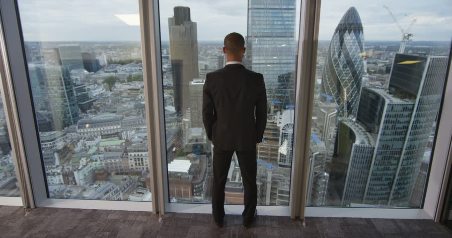 4K View From Behind Of Young Successful Business Executive Looking Out ...