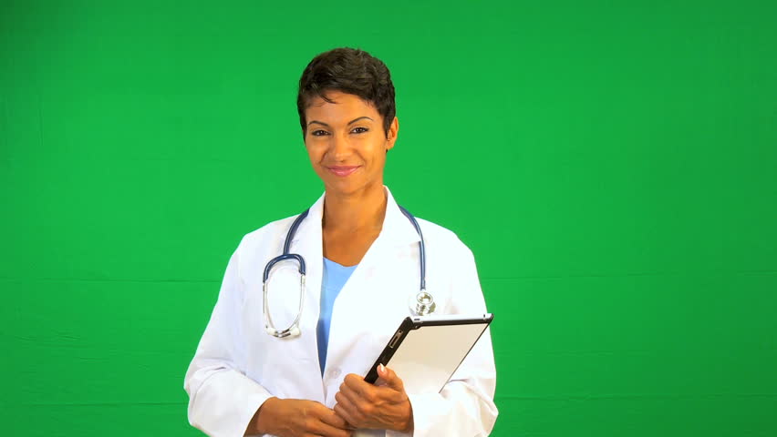 Ethnic Female Doctor On Green Screen Using Wireless Tablet Touch Screen ...