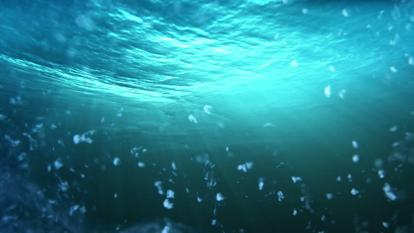 Underwater View Of Tropical Sea Looking Up At The Surface With Sun ...
