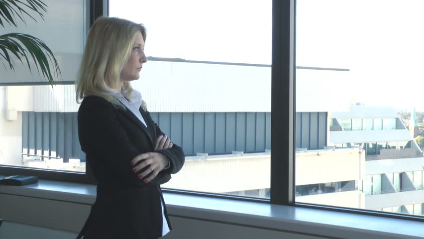 Stock video of a young executive businesswoman looking out | 2293115 ...