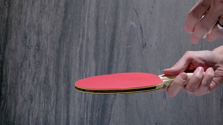 Hand Holding Table Tennis Racket And Bouncing Ping Pong Ball. Slow ...