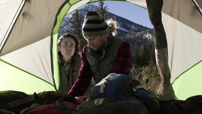 Stock video of friends grab their backpacks from tent | 23973115 ...