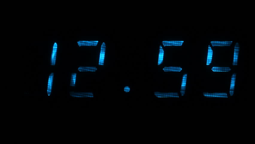 Digital Clock With Fluorescent Display Shows The Time Of 13 Hours 59 ...