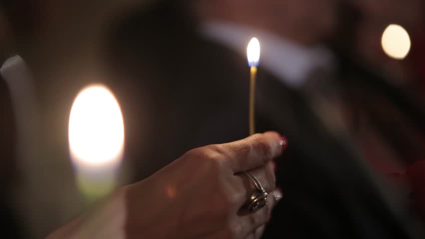 Stock Video Clip of Lighting A Candle With A Match To | Shutterstock