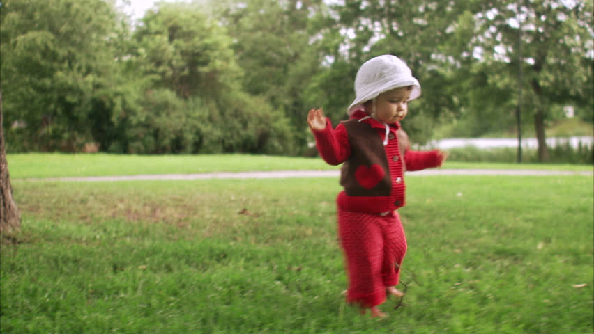 Stock video of a little girl toddling around | 2602565 | Shutterstock