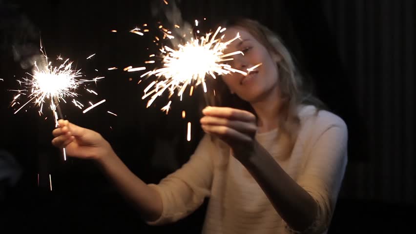 Stock Video Clip of Girl Celebrates, Having Fun With Sparkler in ...