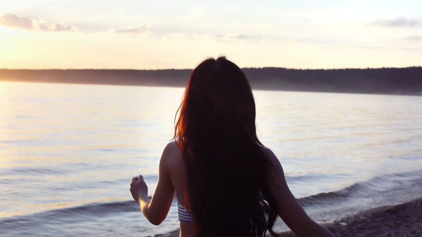 Girl Running And Jumping On The Beach In Slow Motion. Leaping ...