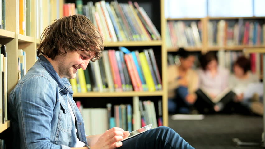 Young Male Caucasian Classmate Using Tablet And Listening To IT Lecture ...