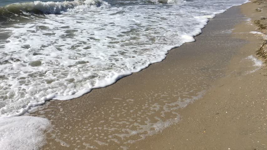Water Washing Up On Shore - Ocean Waves On Golden Brown Sand ...