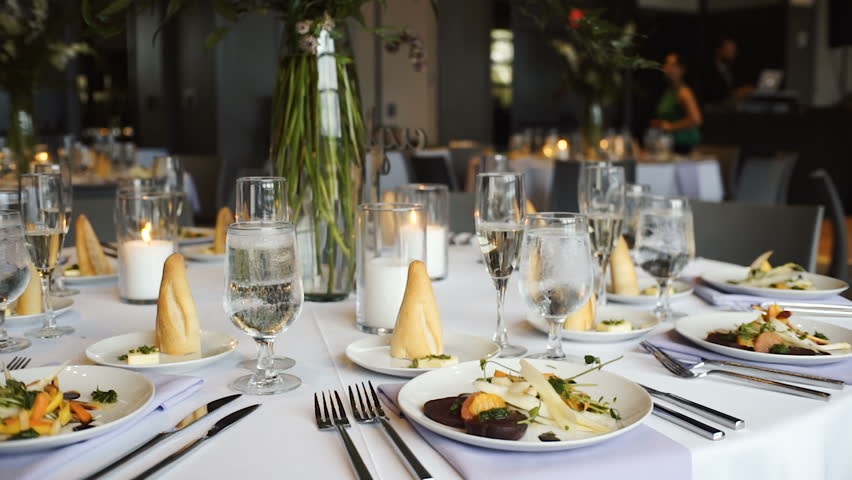 Panning Shot Of Place Setting At Wedding Reception. Food And Drinks On ...