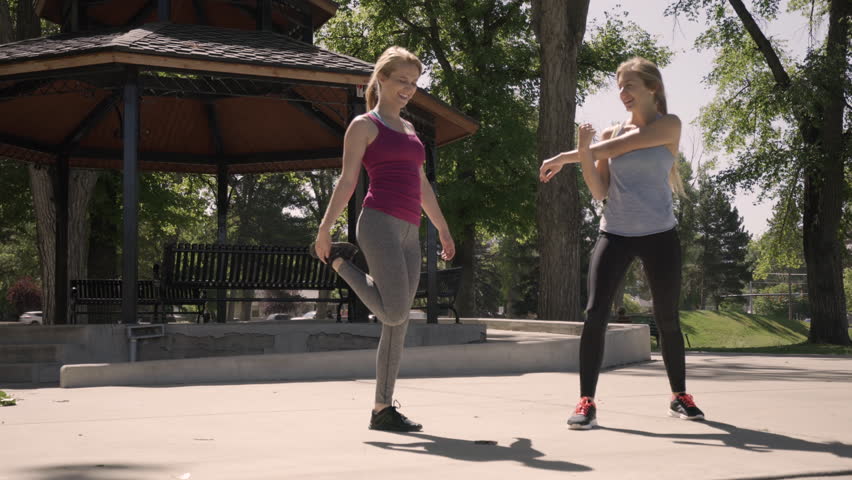 Stock Video Clip of Friends Stretch And Warm Up Together Before ...