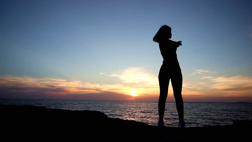 Stock video of sea stretch woman stretching by the coast | 2899885 ...