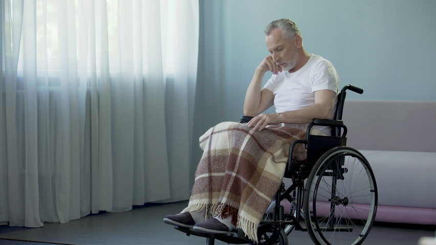 Pensive And Sad Man In Wheelchair - Disabled - Handicapped - Crying ...