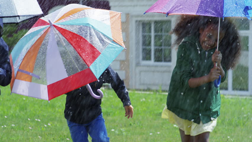 Cinemagraph Of Little Boy Holding Umbrella And Catching Raindrops In ...