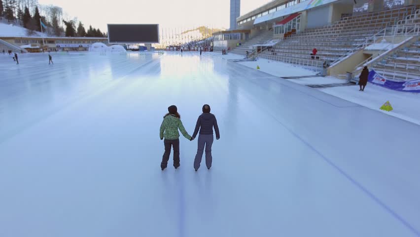 Aerial View From Drone Of Ice Skating Young Woman Outdoor, Ice Rink ...