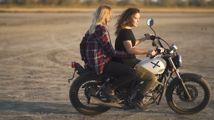 Young Beautiful Woman Dances In The Desert At Sunset Or Sunrise ...