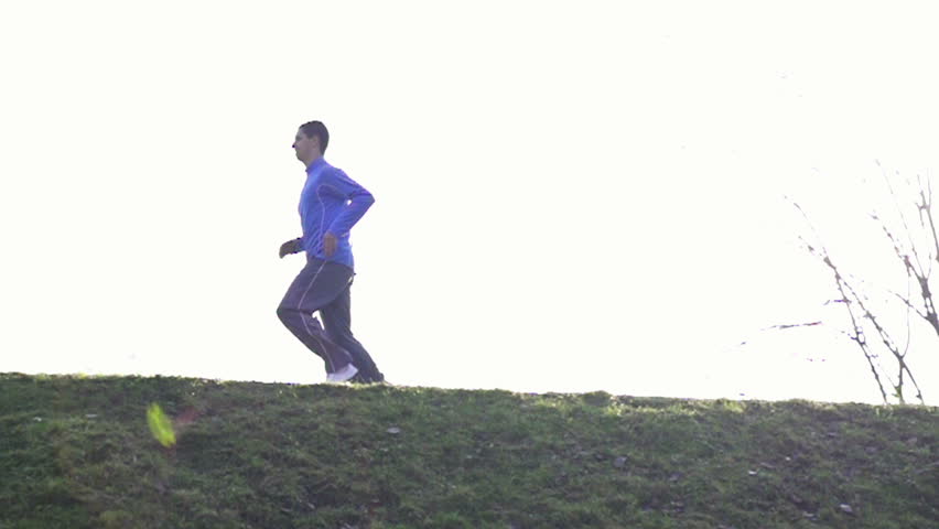 Stock video of man jogging in park, super slow | 3149875 | Shutterstock