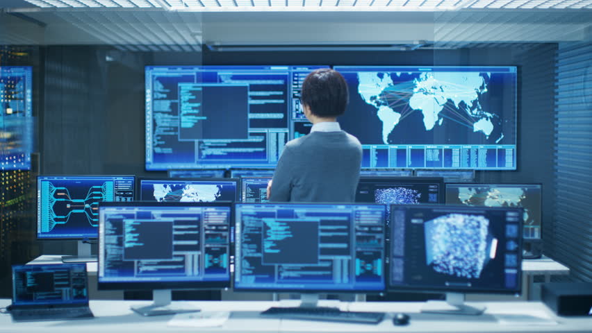 Back View Of Technical Controller/ Operator Working At His Workstation ...