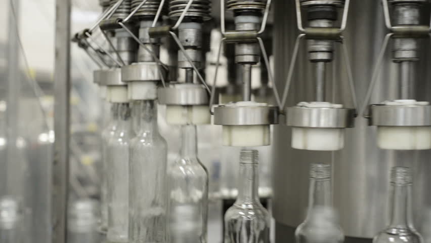 Operation Of An Automatic Bottle Filling Machine With Liquid. Automatic ...